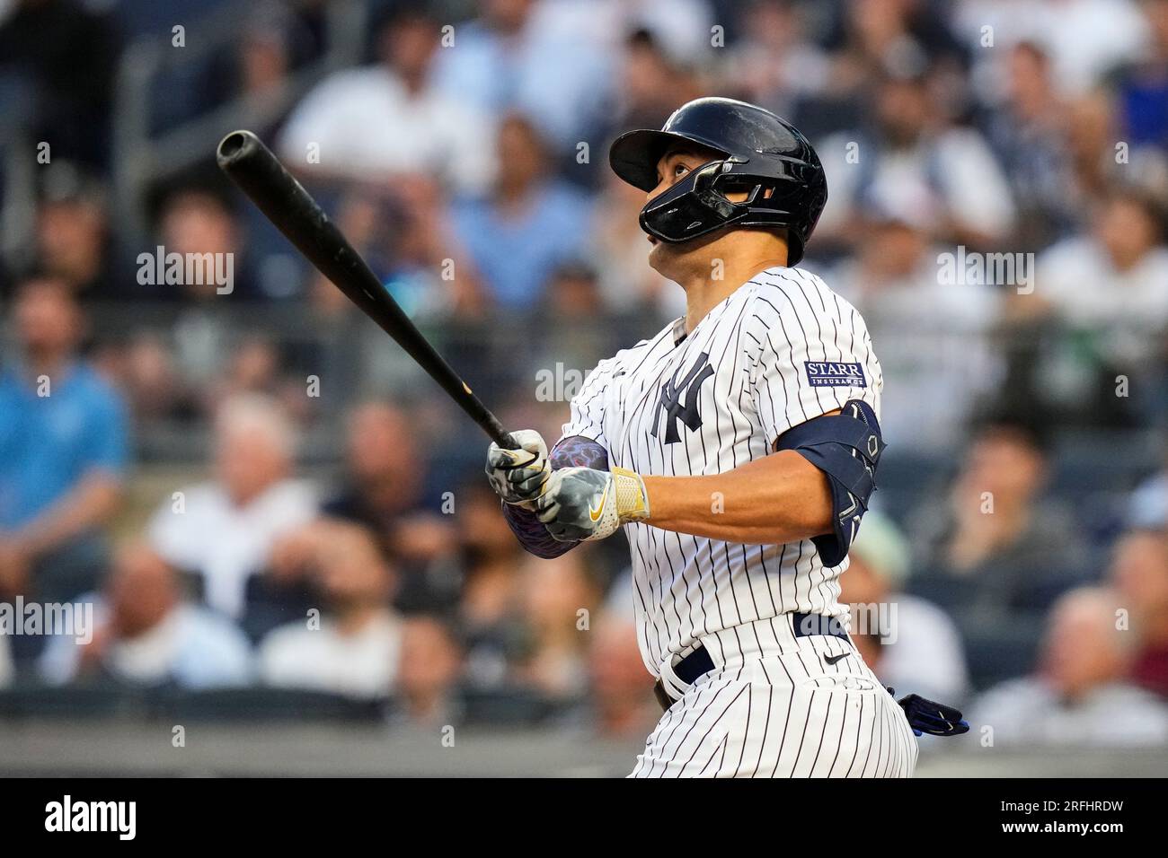 New York Yankees' Giancarlo Stanton watches his two-run home run ...