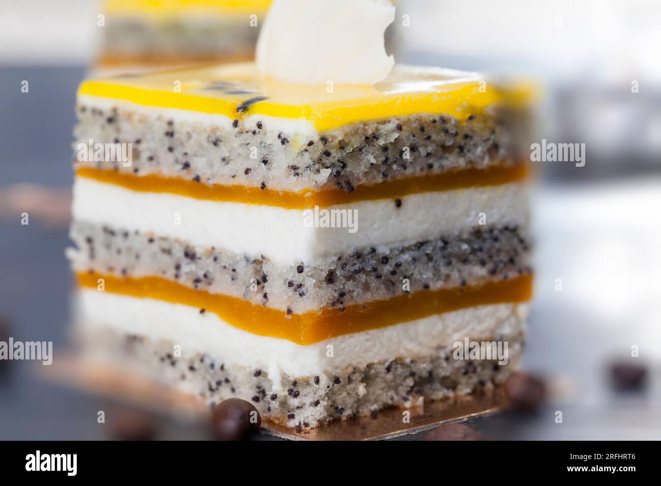 multi layered sponge cake with poppy seeds, mango fruit filling and ...