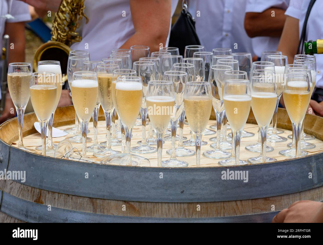 Tasting of sparkling white wine with bubbles champagne on summer ...