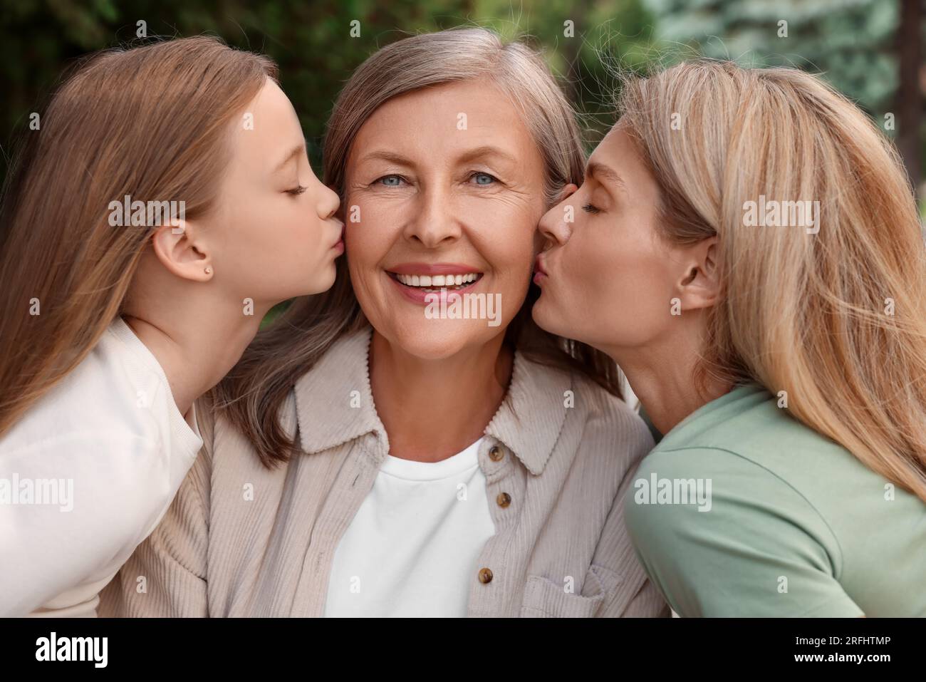 Three generations. Happy grandmother, her daughter and granddaughter ...
