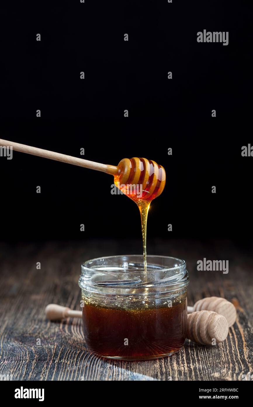 thick and sweet buckwheat honey of dark red color from buckwheat ...