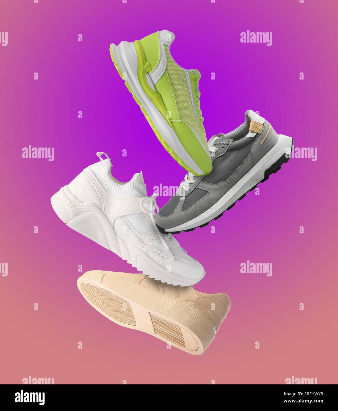 Different sneakers falling on pink gradient background Stock Photo - Alamy