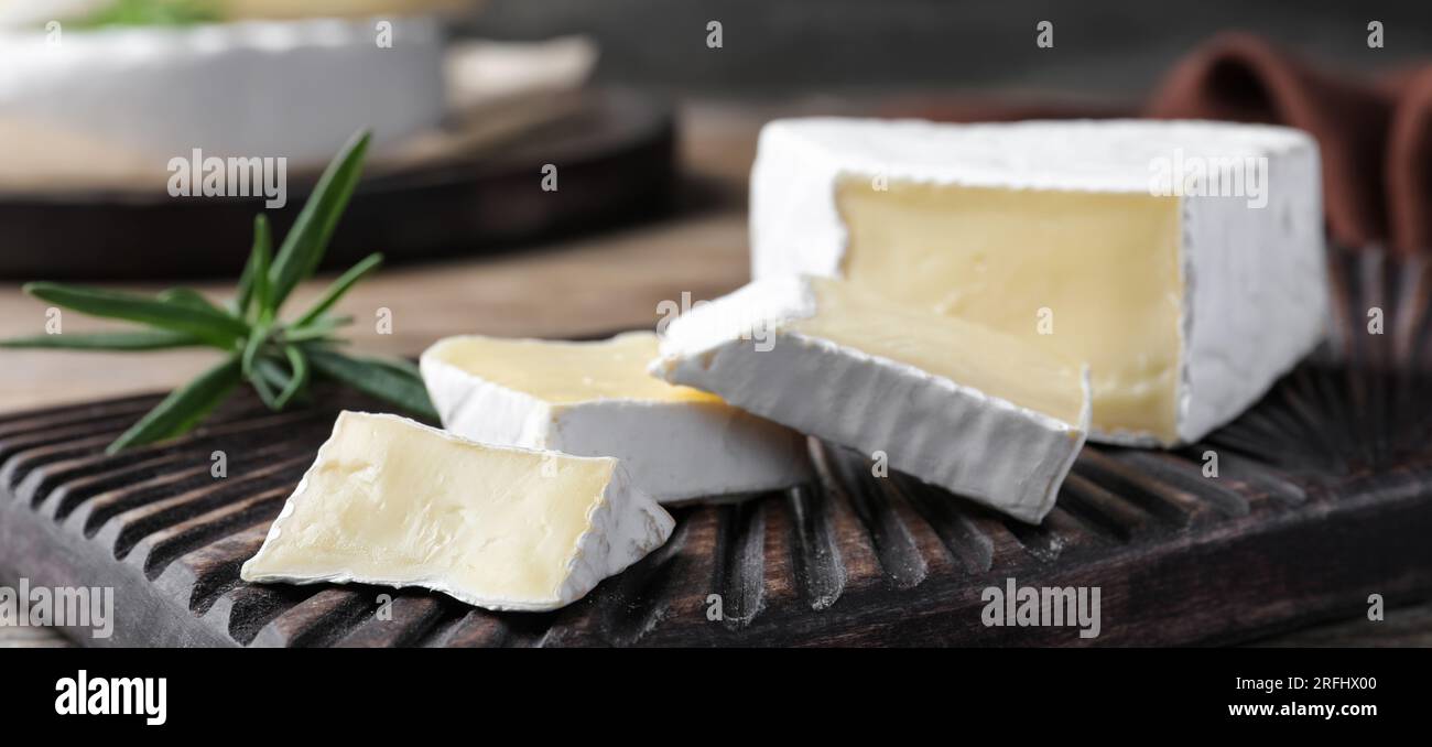 Tasty brie cheese on table, closeup. Banner design Stock Photo - Alamy