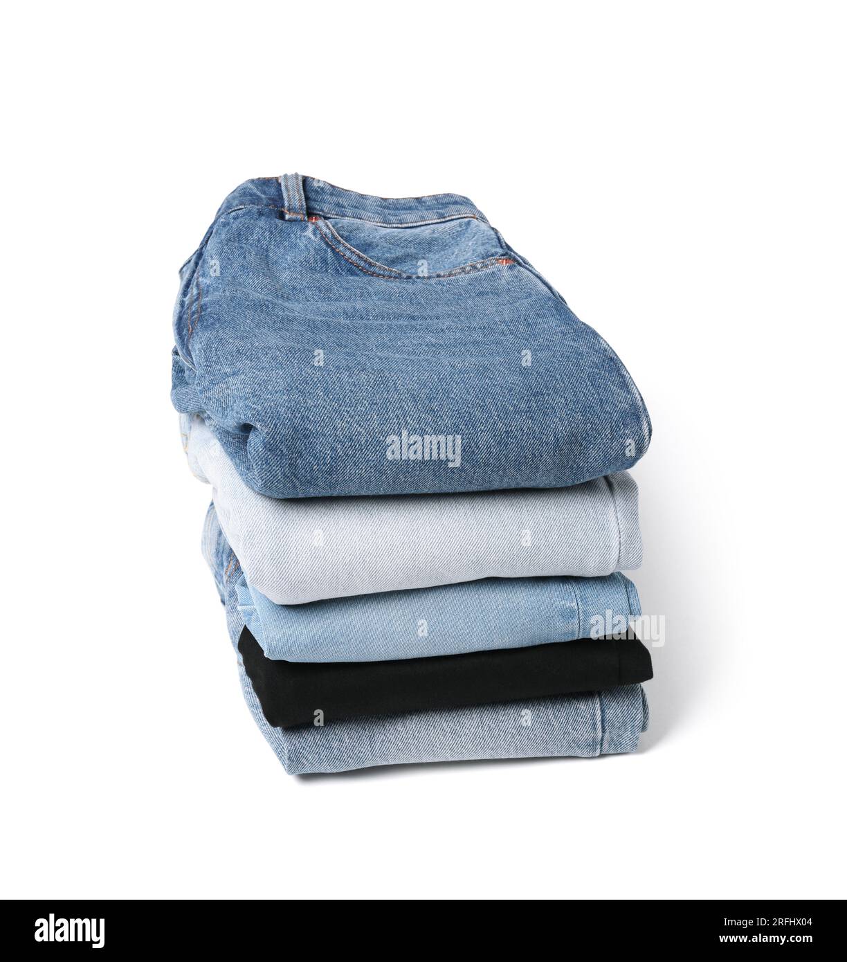 Stack of different folded jeans isolated on white Stock Photo - Alamy