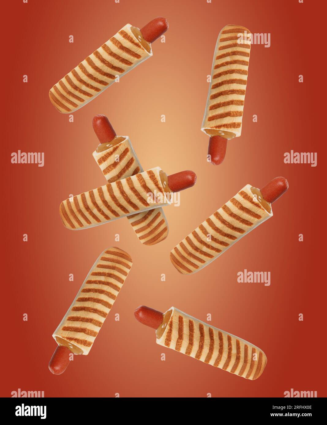 Yummy French hot dogs with grilled buns falling on red gradient background Stock Photo - Alamy