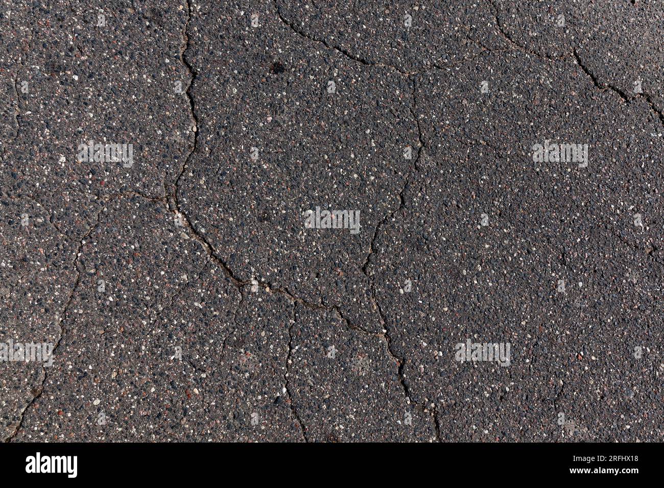 repair of a broken and damaged paved road, the road has many defects ...