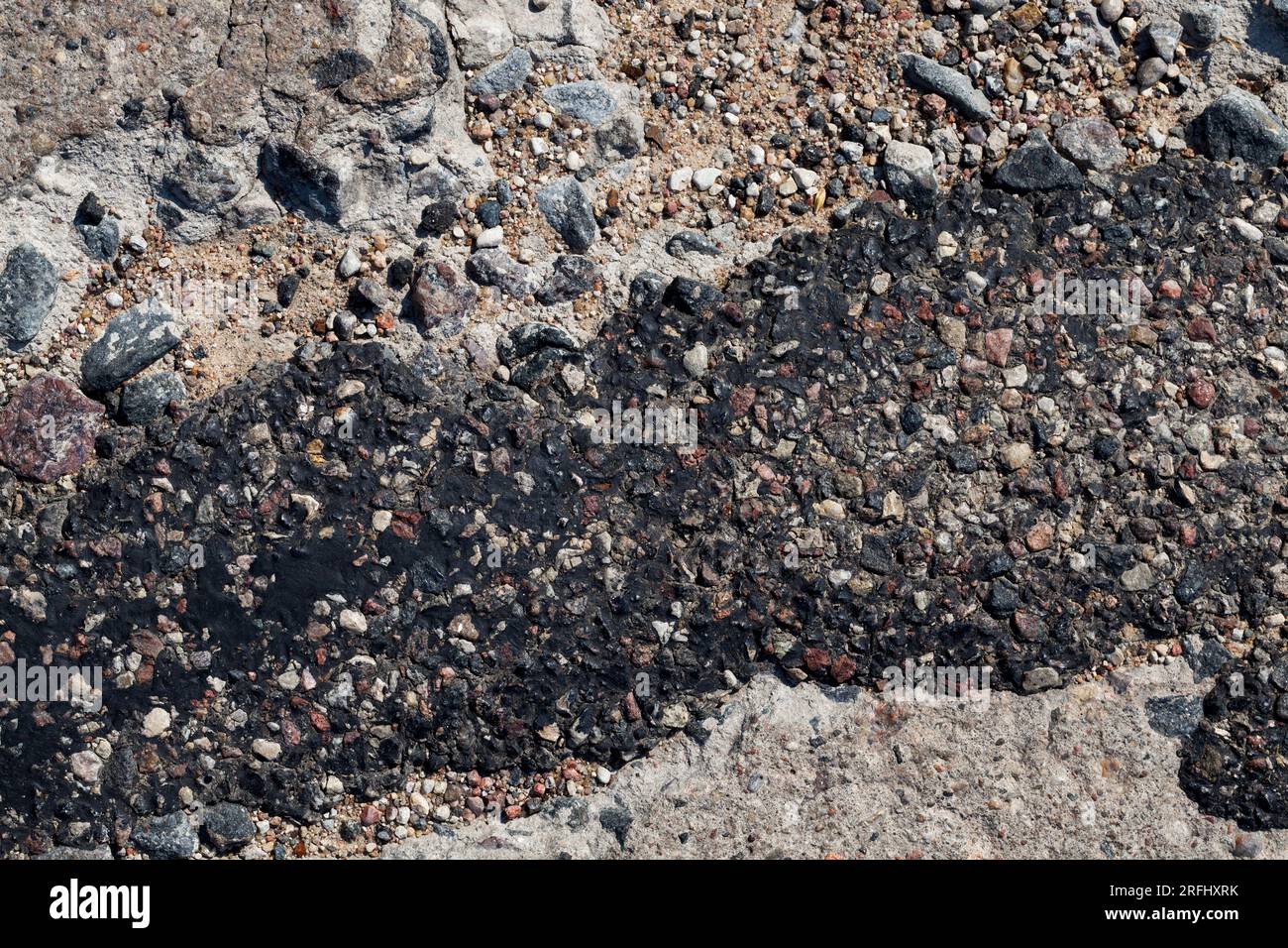 a road of poor quality on which traffic is difficult, a bad asphalt ...