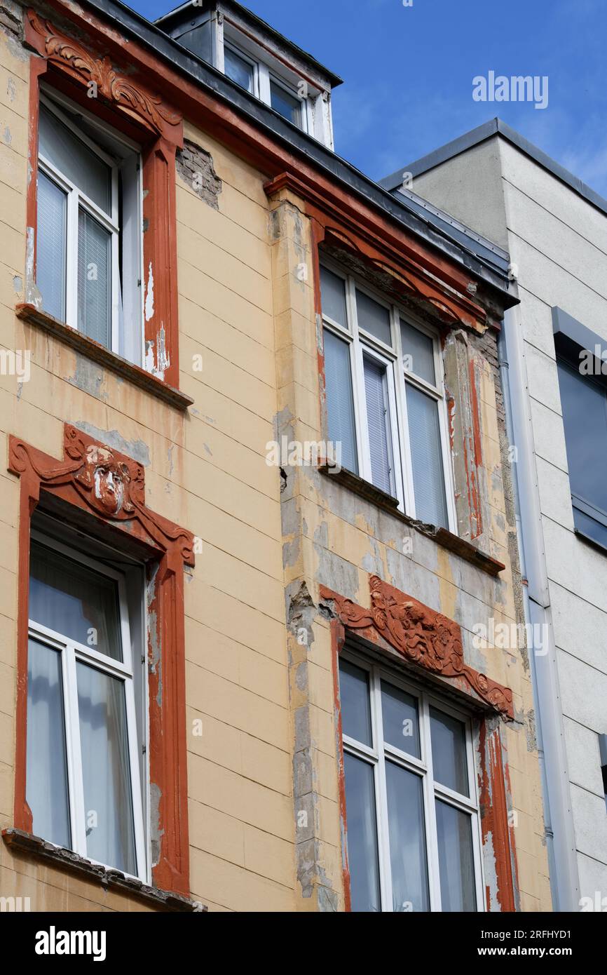old town house in need of renovation with peeling paint and damage to ...