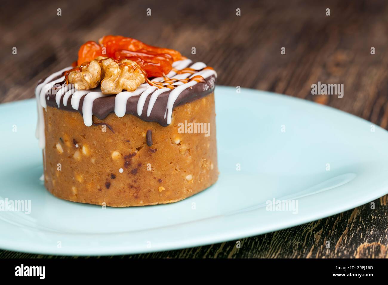 sweet cake in the shape of a cylinder, made of peanuts, sugar and dairy ...