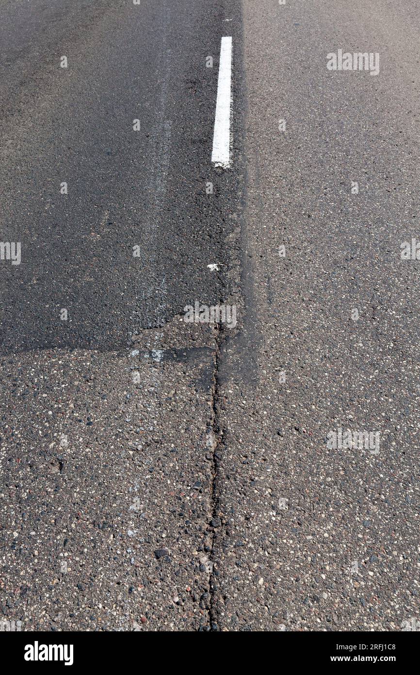 painted with white paint automobile road markings, paved road with ...