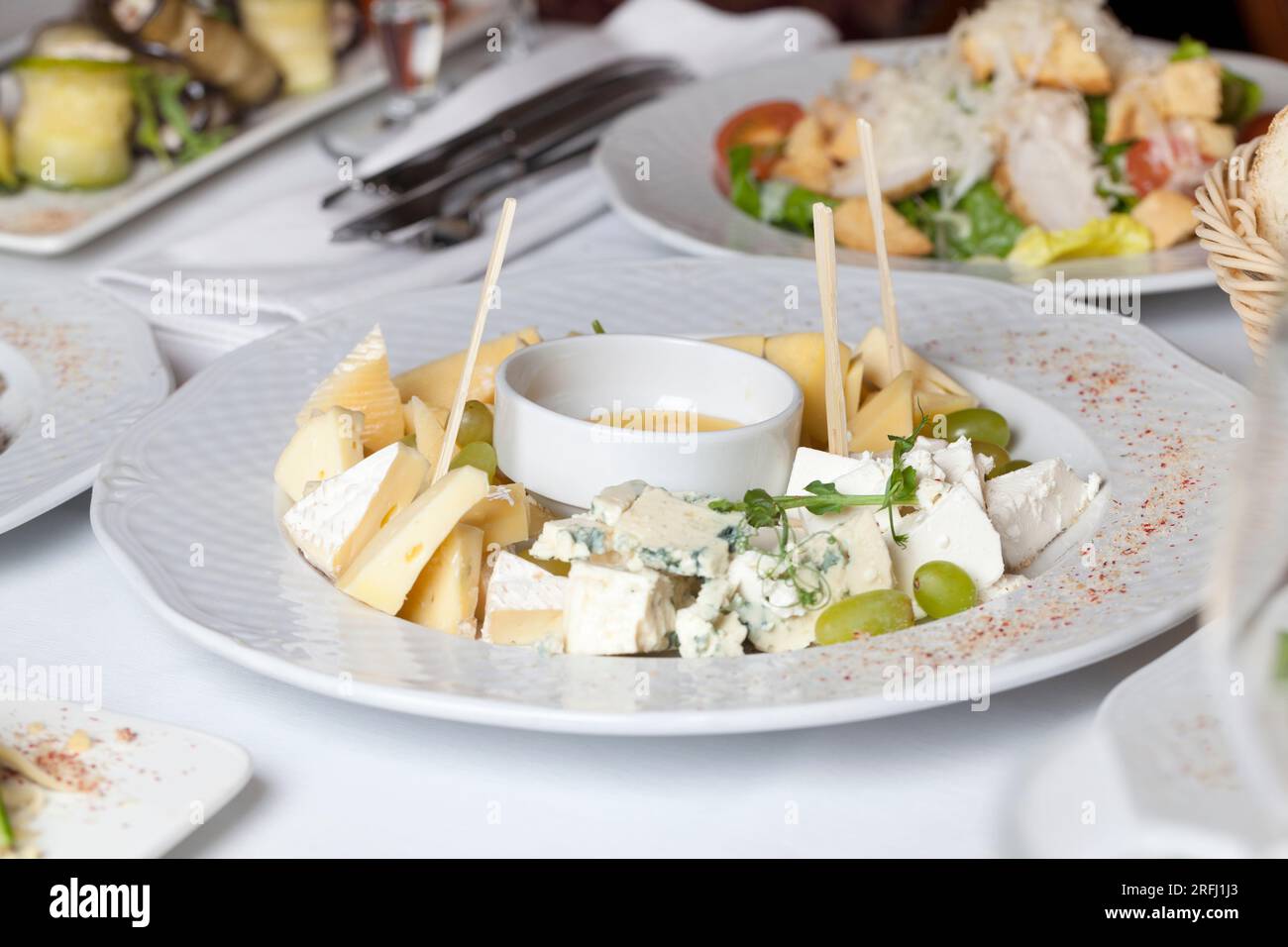 different types of cheese with sauce, a banquet table on which ...