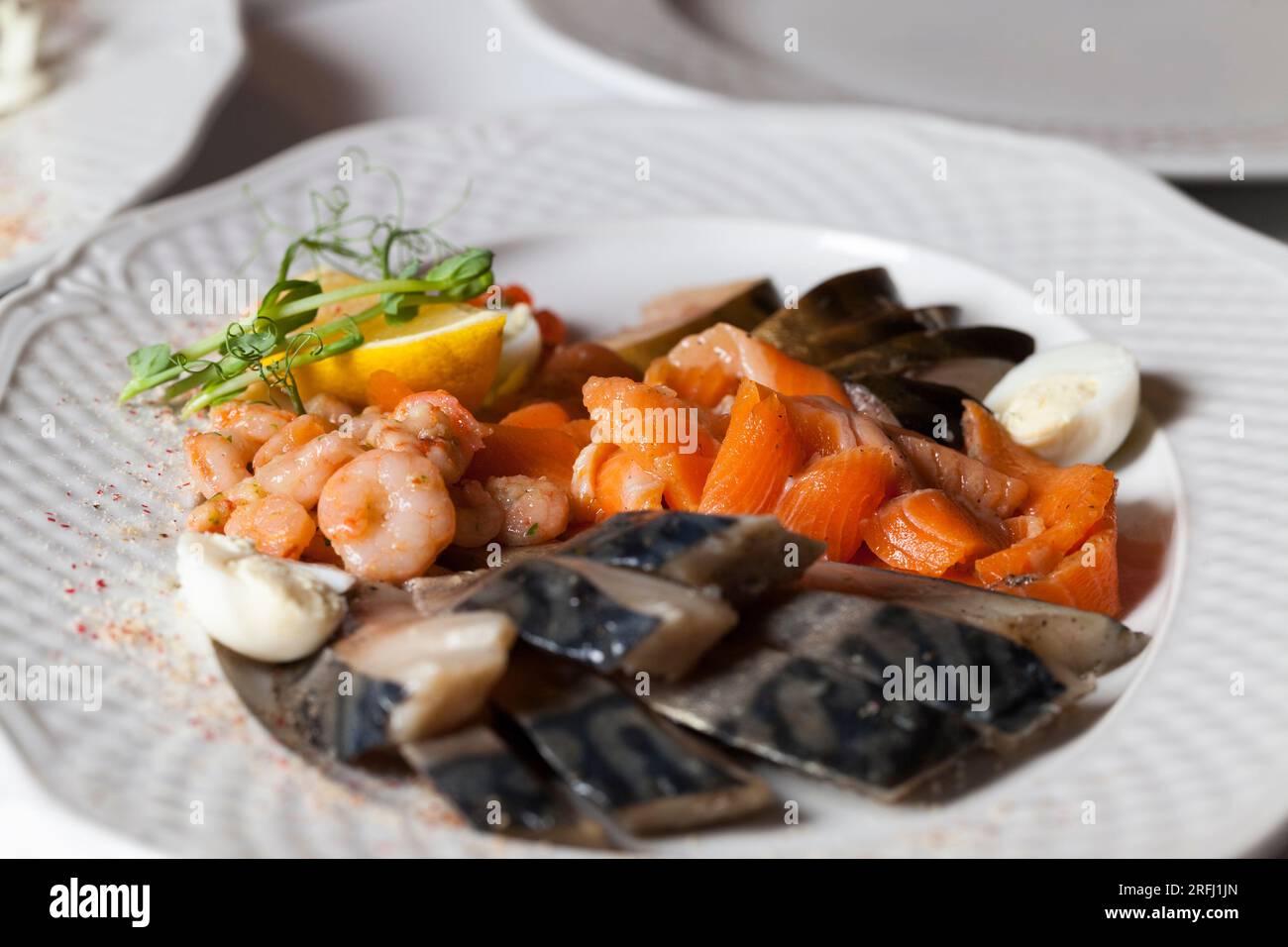 different varieties of fish on a bowl on a banquet table, the fish is ...