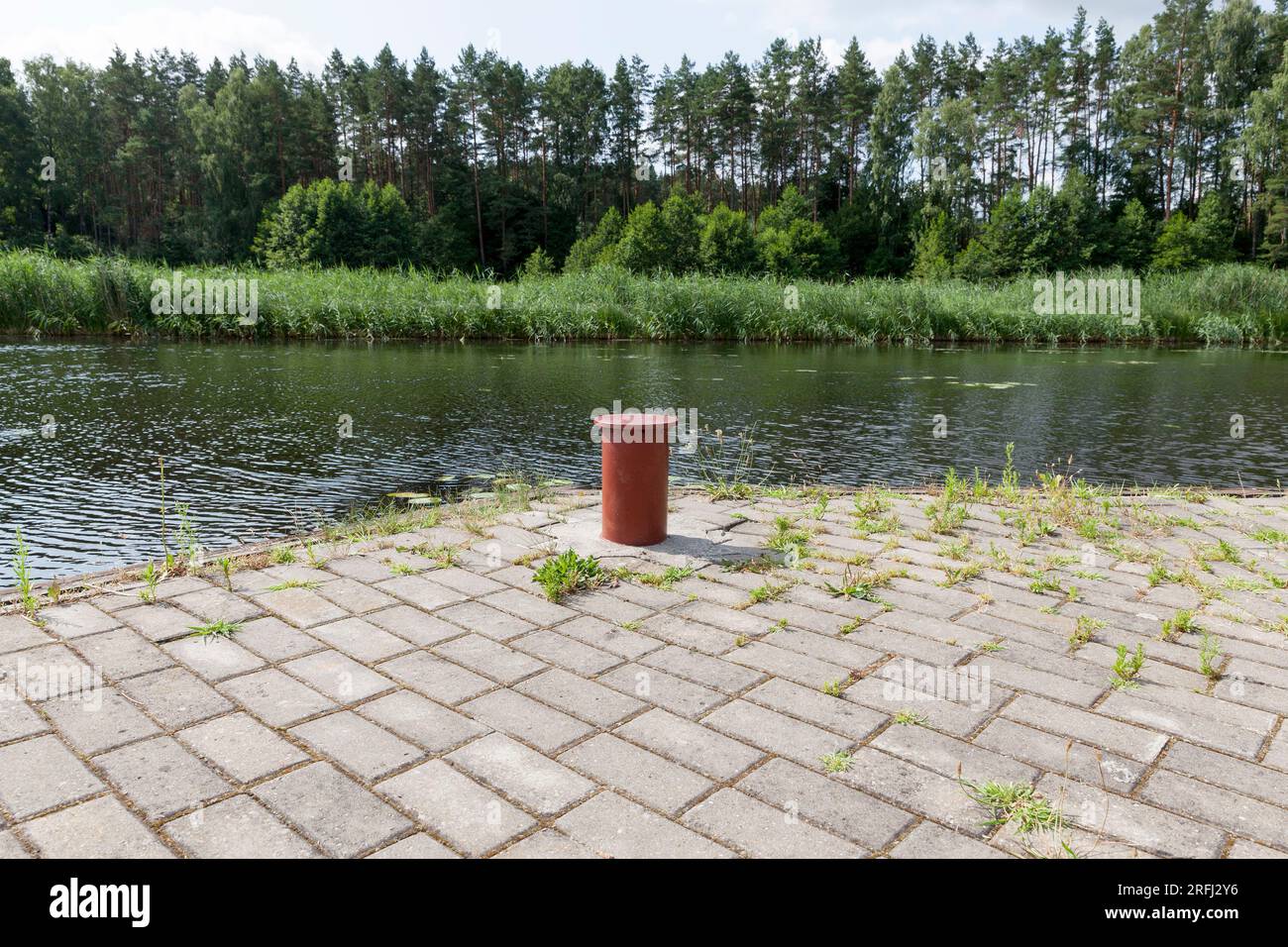 metal attachment for mooring boats and ships at the pier near the lake ...