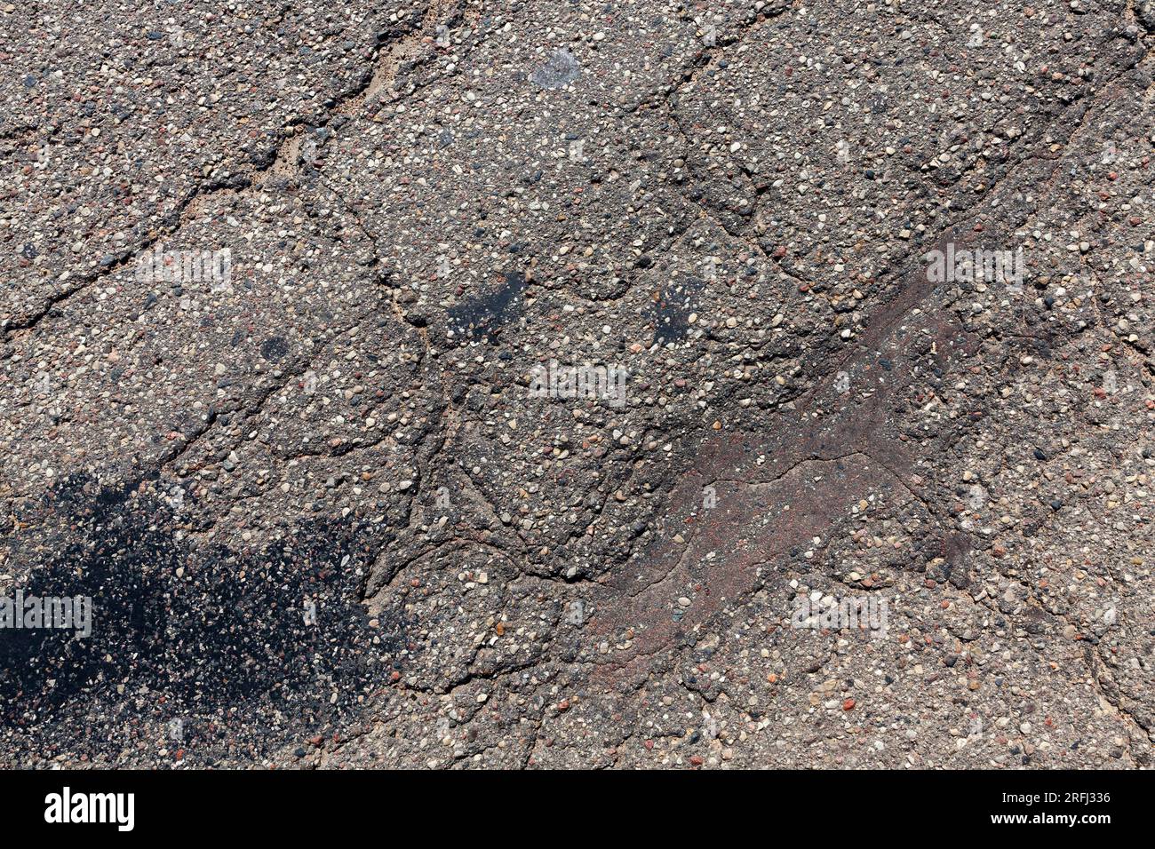 paved road with a lot of holes and potholes, poorly made and dangerous ...