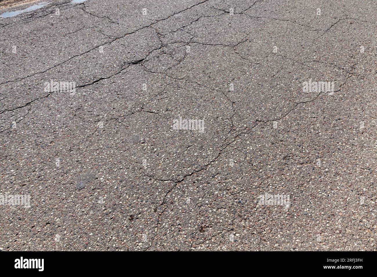 repair of a broken and damaged paved road, the road has many defects ...