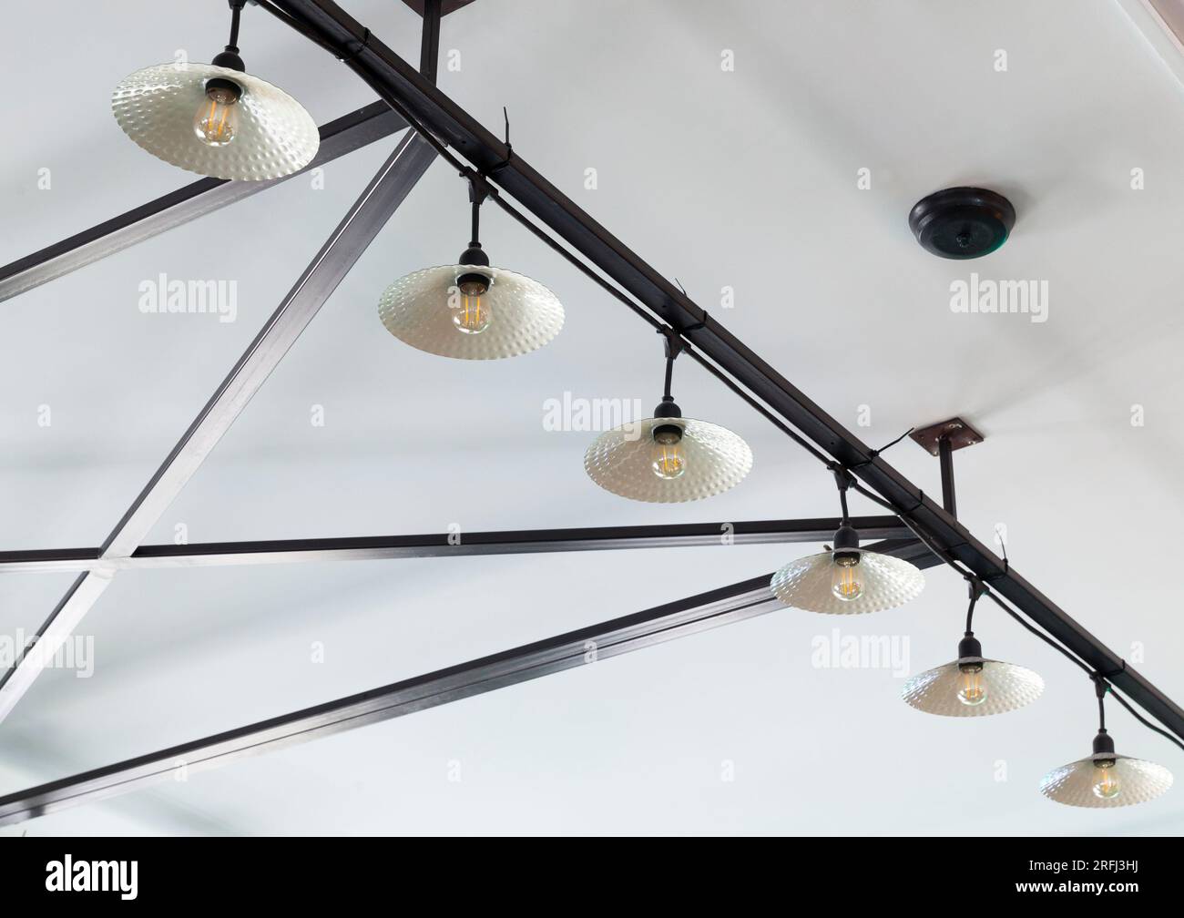 lighting system with lamps installed on the ceiling in the room ...