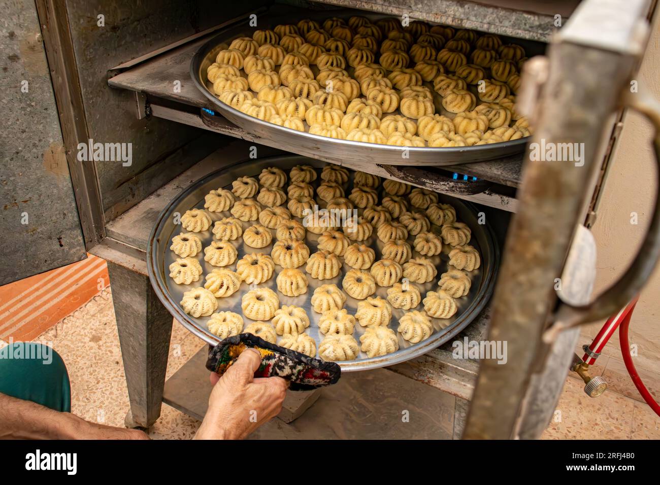 hands holding plate of eid cookies after beeing baked Stock Photo - Alamy