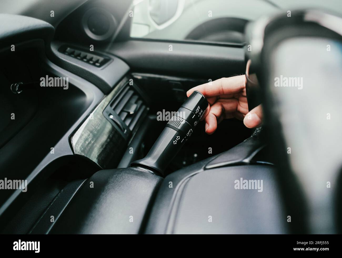 The driver hand turn on the turn signal switch in the car, Automotive ...