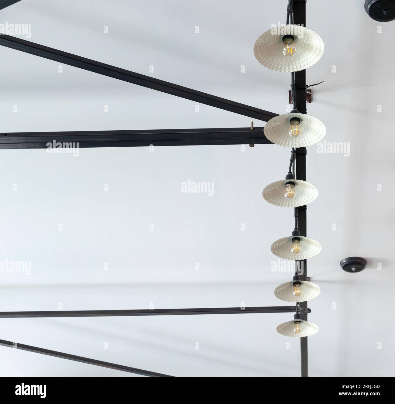 lighting system with lamps installed on the ceiling in the room ...