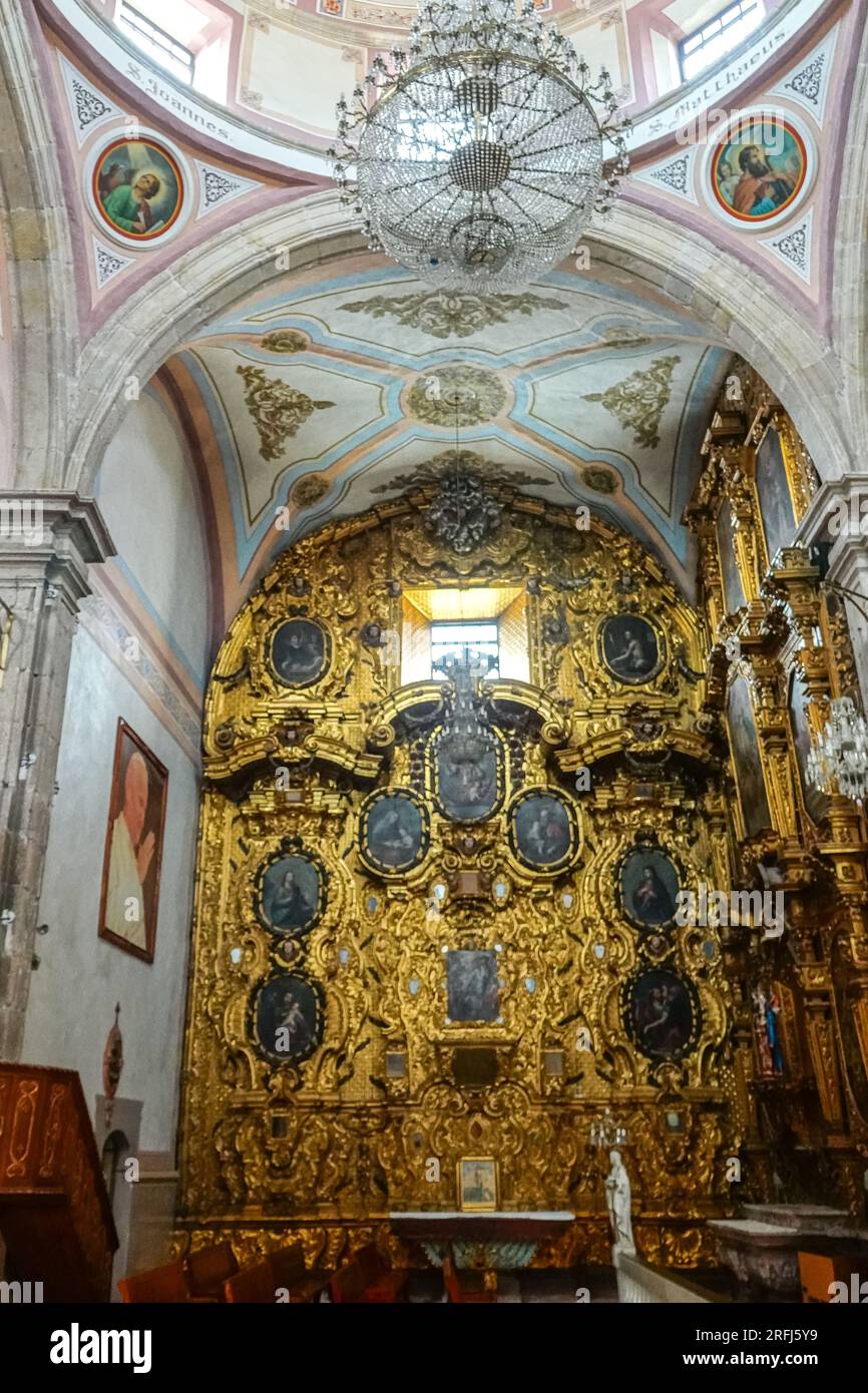 The 400-year-old gold altarpiece inside the baroque style Temple of San ...