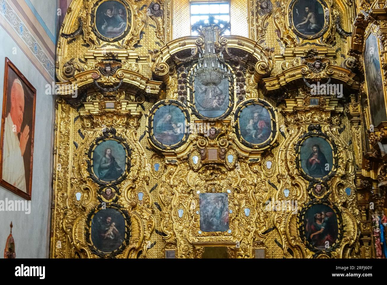 The 400-year-old gold altarpiece inside the baroque style Temple of San ...