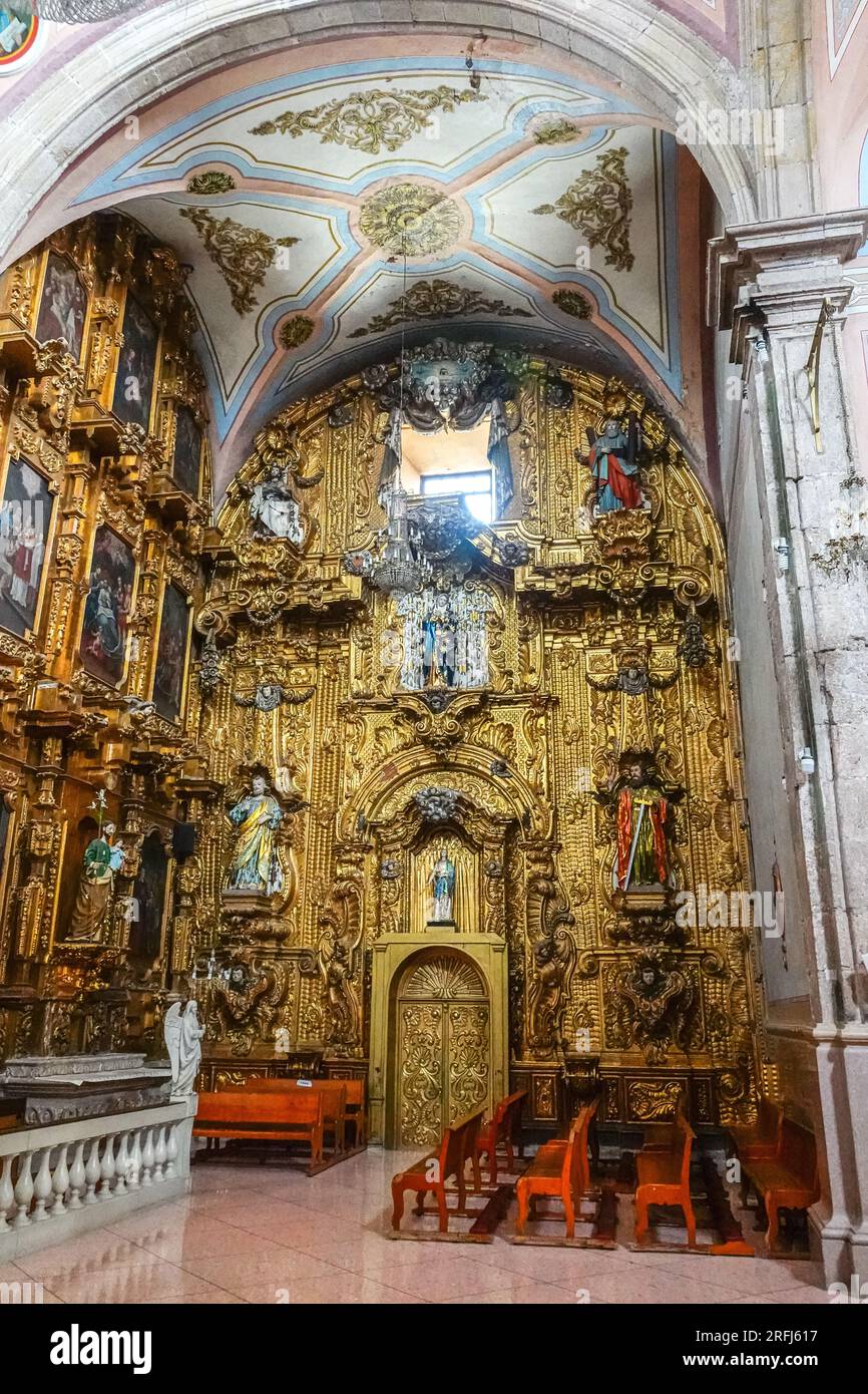 The 400-year-old gold altarpiece inside the baroque style Temple of San ...