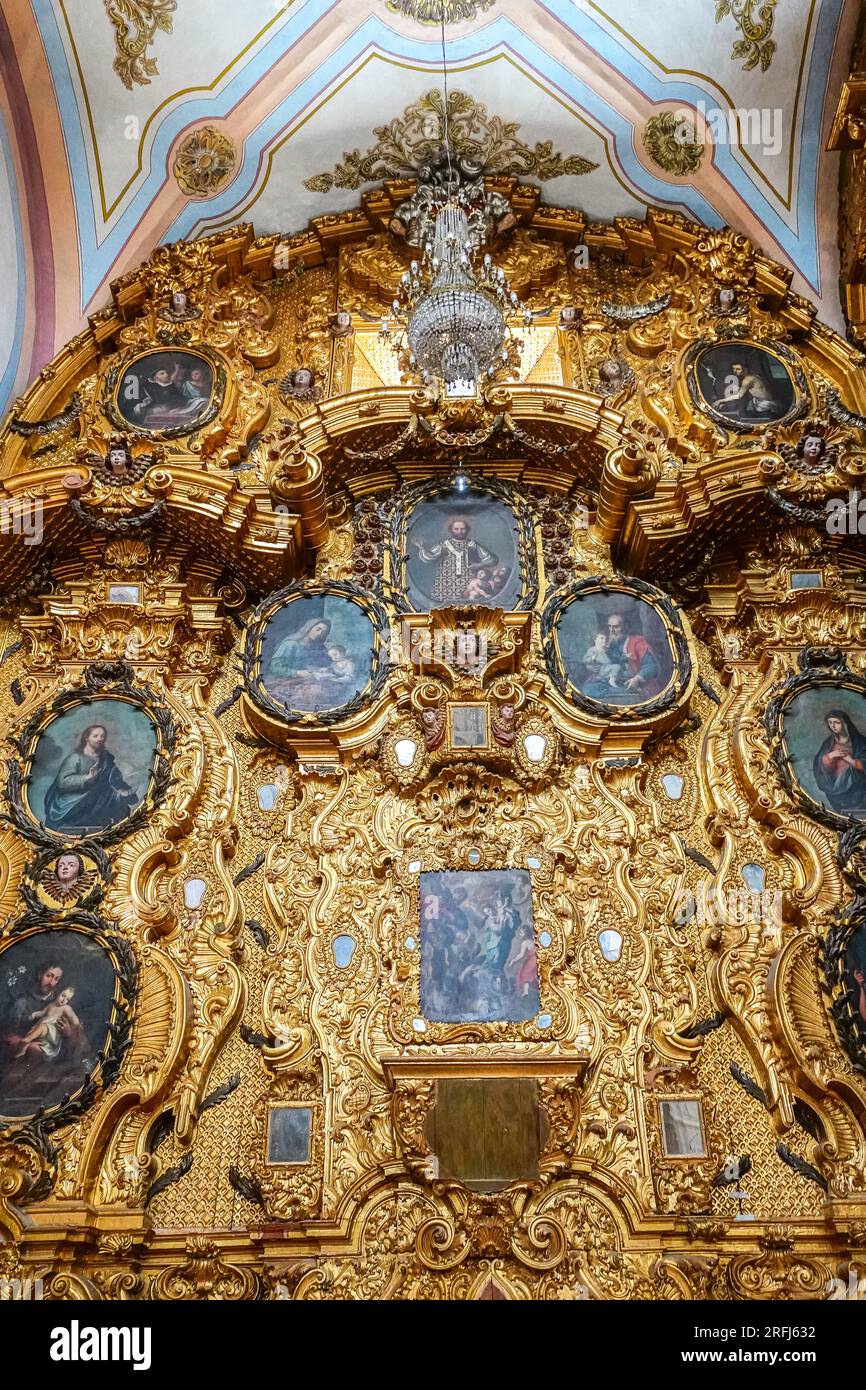 The 400-year-old gold altarpiece inside the baroque style Temple of San ...
