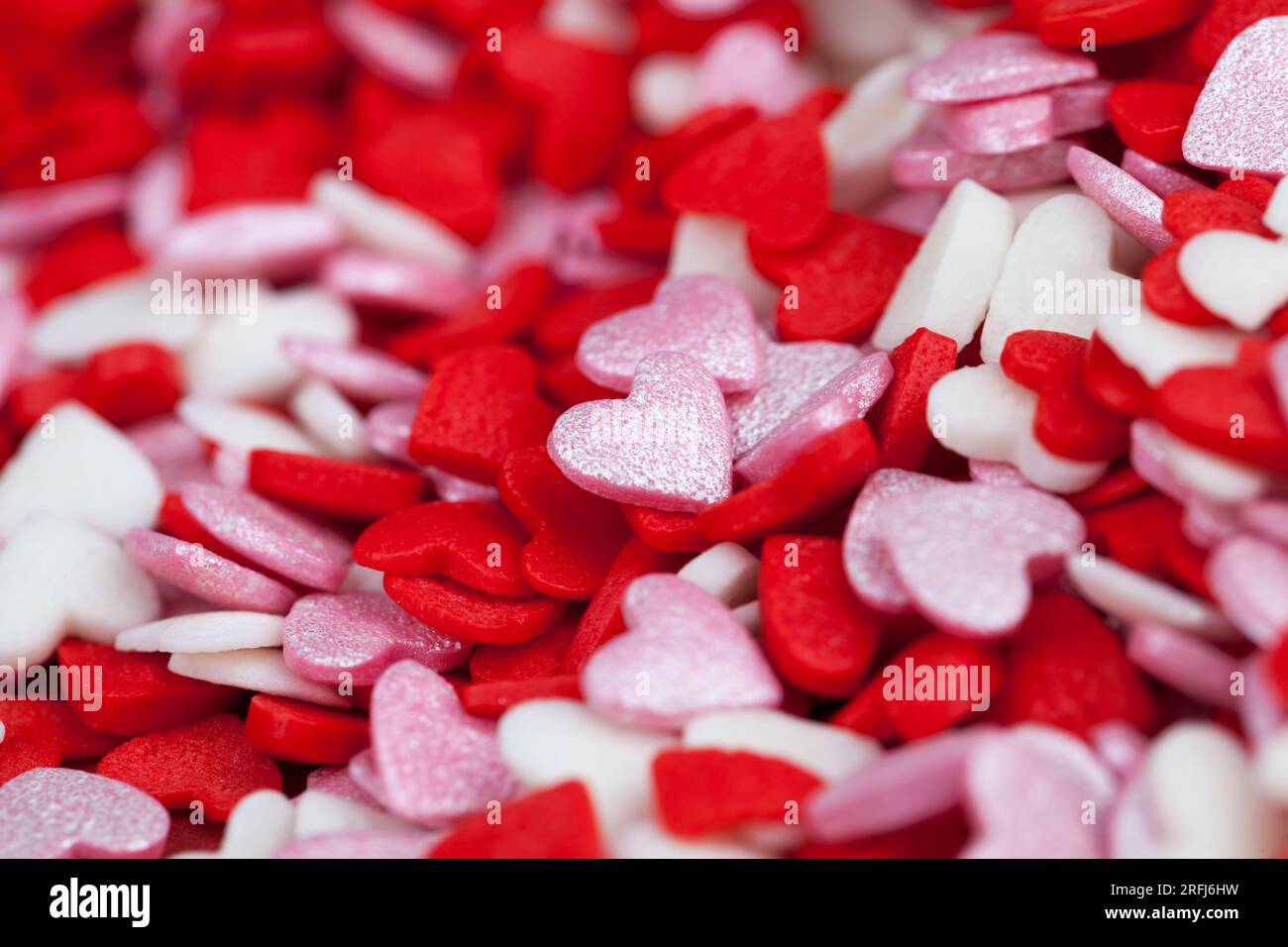red and white sweet heart shaped candies for decorating desserts and ...