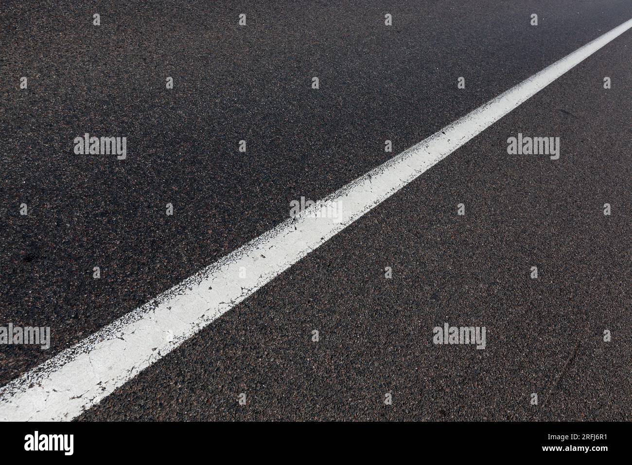 paved road with white road markings, painted with white paint ...