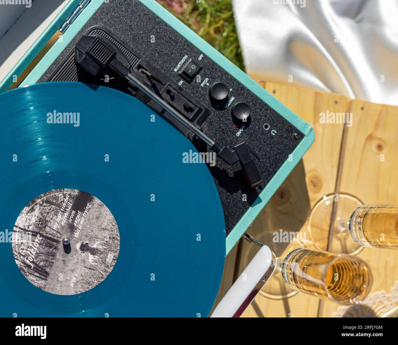 Blue Record Player playing Folklore by Taylor Swift Record at Outdoor ...