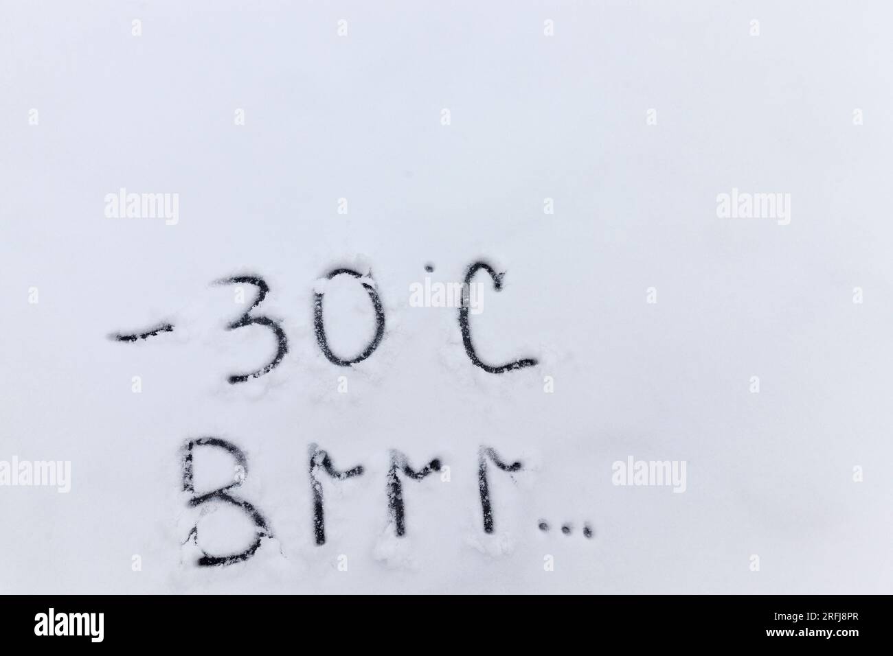 drawn on the snow, temperature symbols denoting negative very cold ...