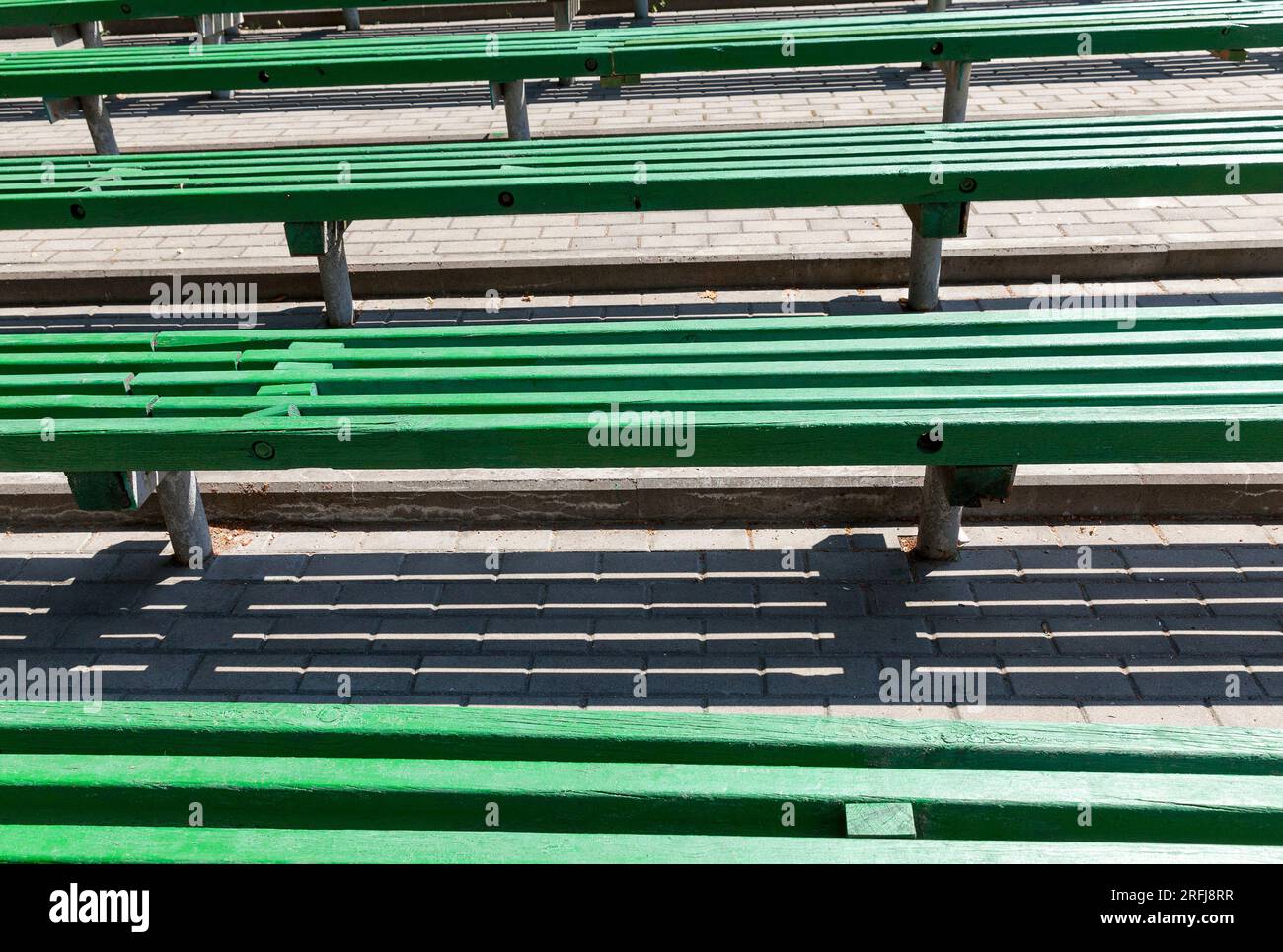 old benches located in a summer amphitheater without a roof, old wooden ...