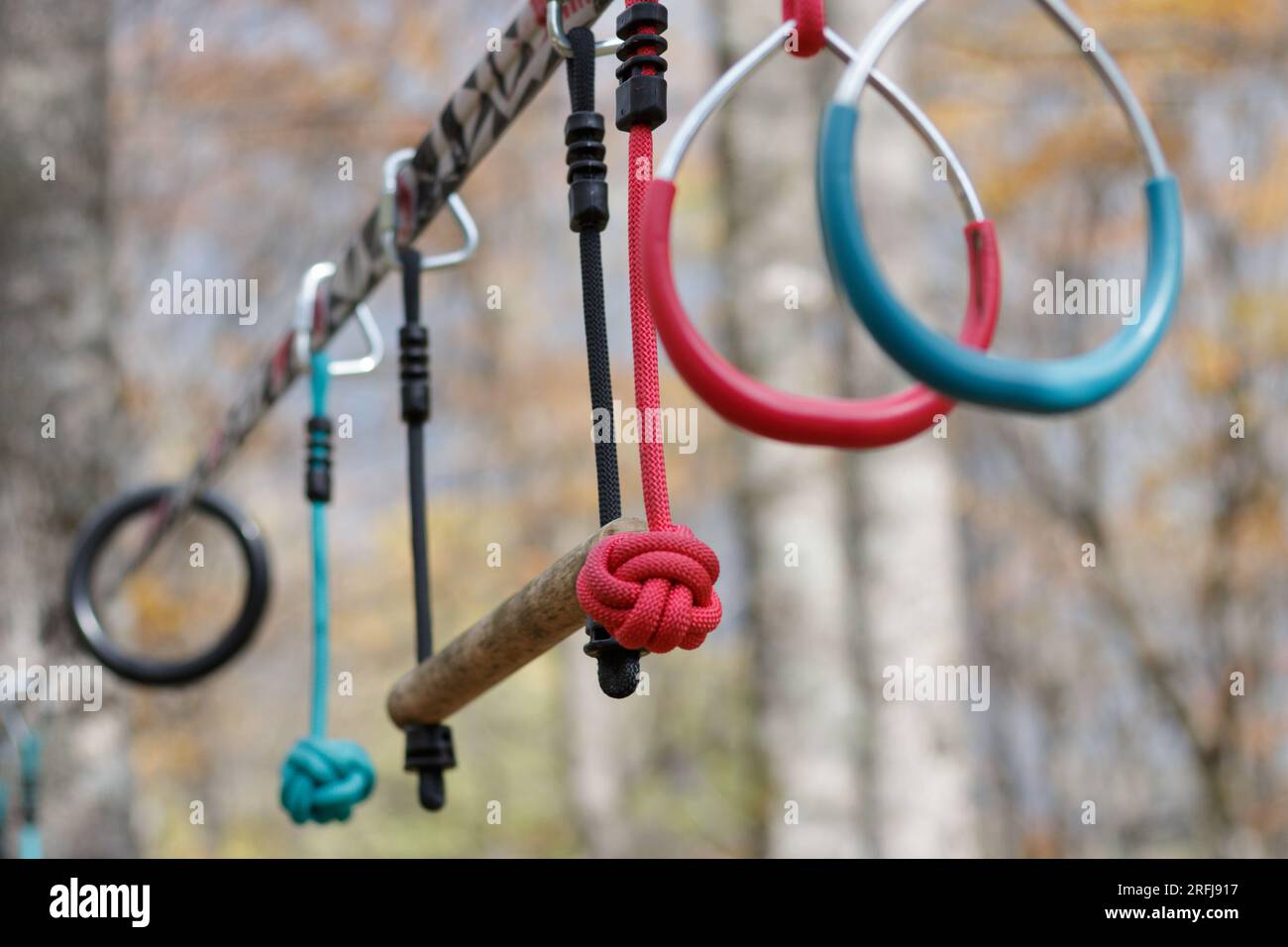 Colourful recreational exercise hoops and bars hanging on a line ...