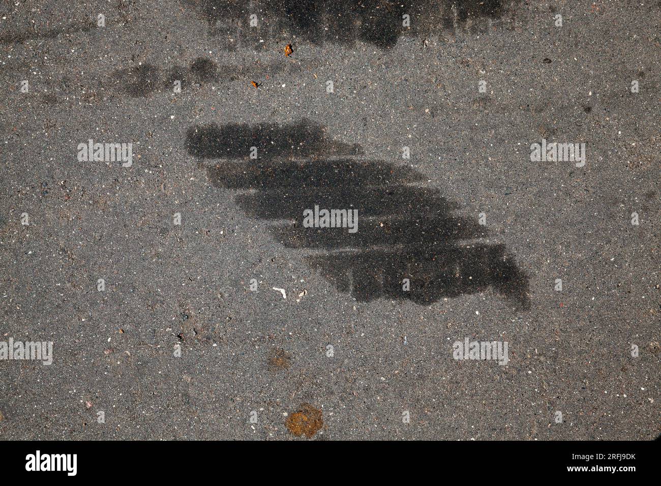 stains from engine oil flowing out of cars, car oil stains on an ...