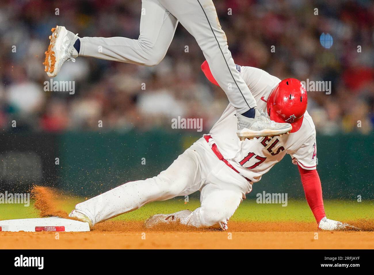 Los Angeles Angels' Shohei Ohtani slides under Seattle Mariners second ...