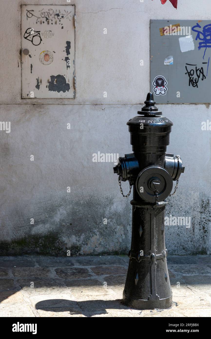 Black fire hydrant on the street in Vienna Stock Photo - Alamy