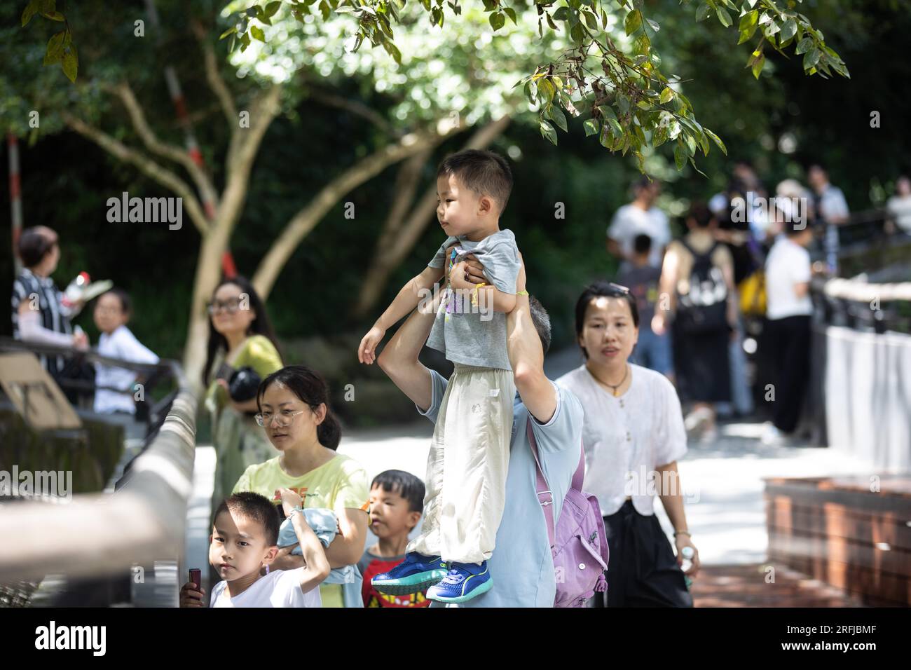 Many people come to watch the Malayan sun bear who can stands upright ...