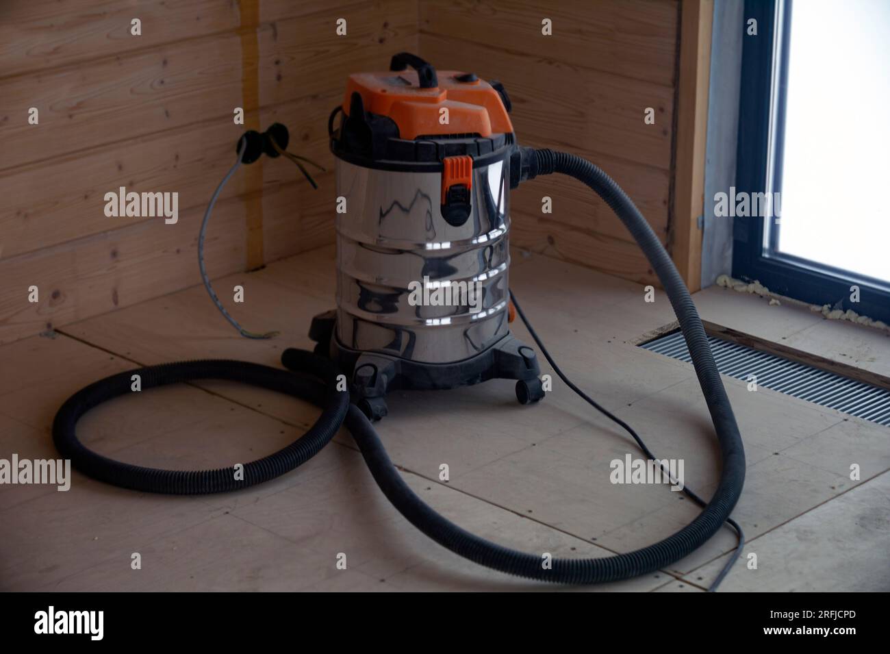 powerful vacuum cleaner on the floor of a house under renovation Stock ...