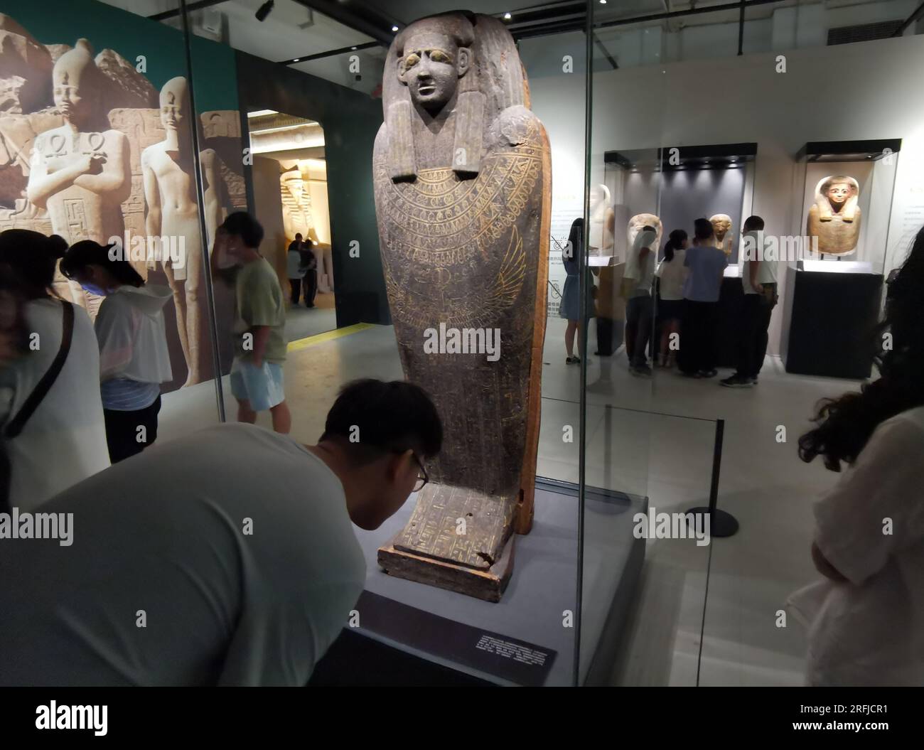 People visit the exhibition featuring mummies and rare relics of ...