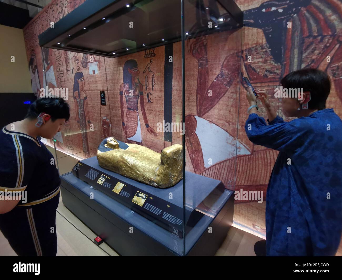 People visit the exhibition featuring mummies and rare relics of ...