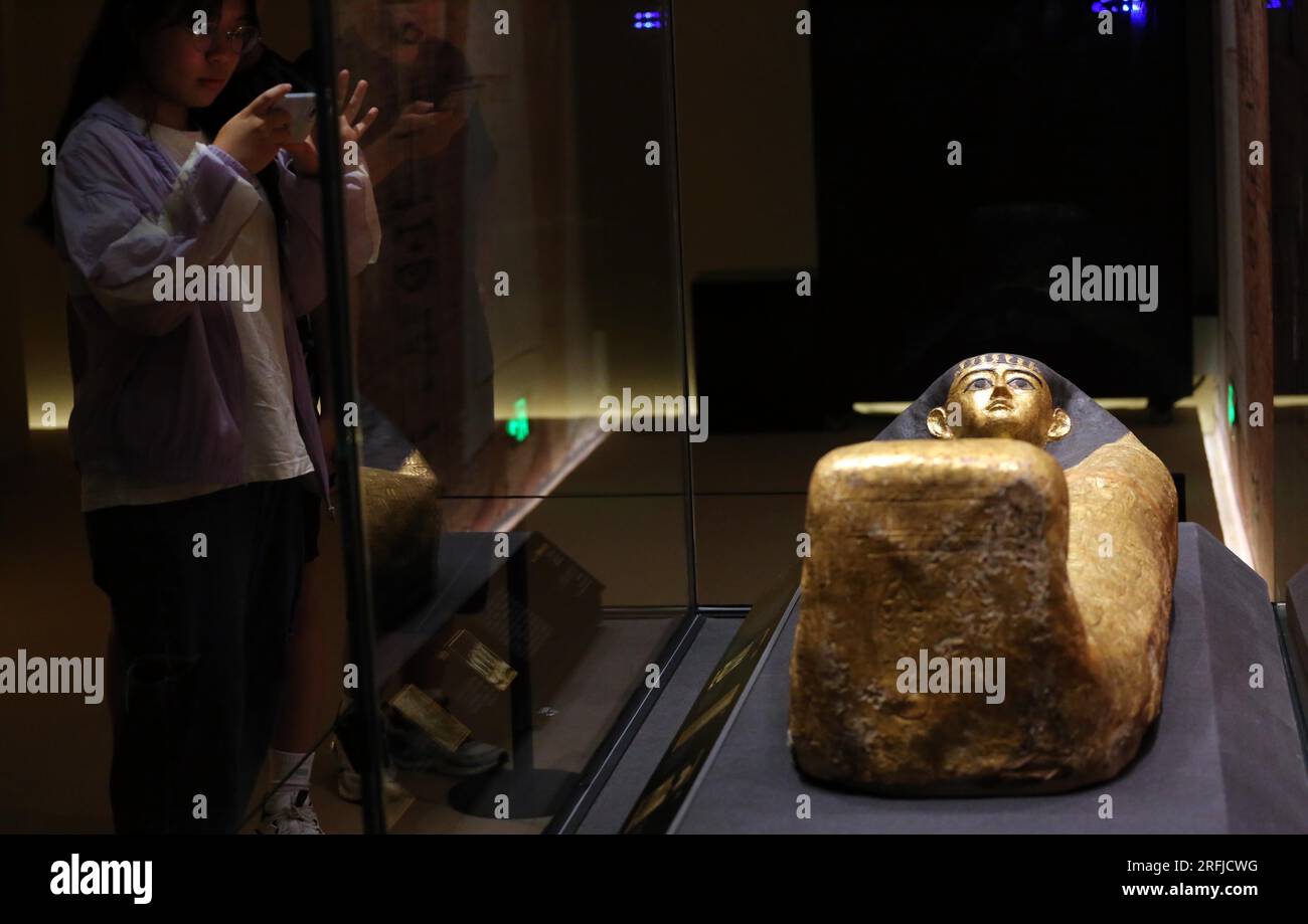 People visit the exhibition featuring mummies and rare relics of ...