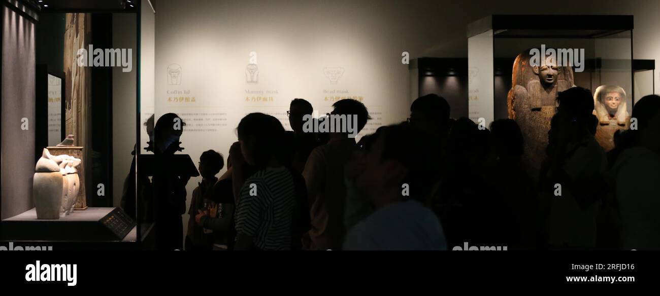 People visit the exhibition featuring mummies and rare relics of ...