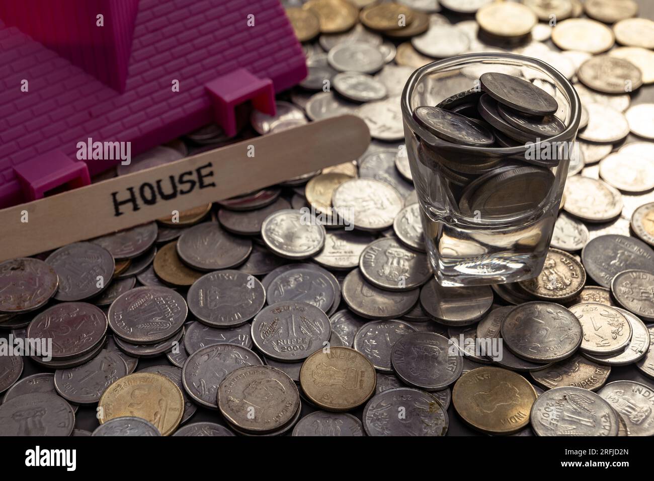 A close-up photo of Indian rupees coins spread on a table. The coins ...