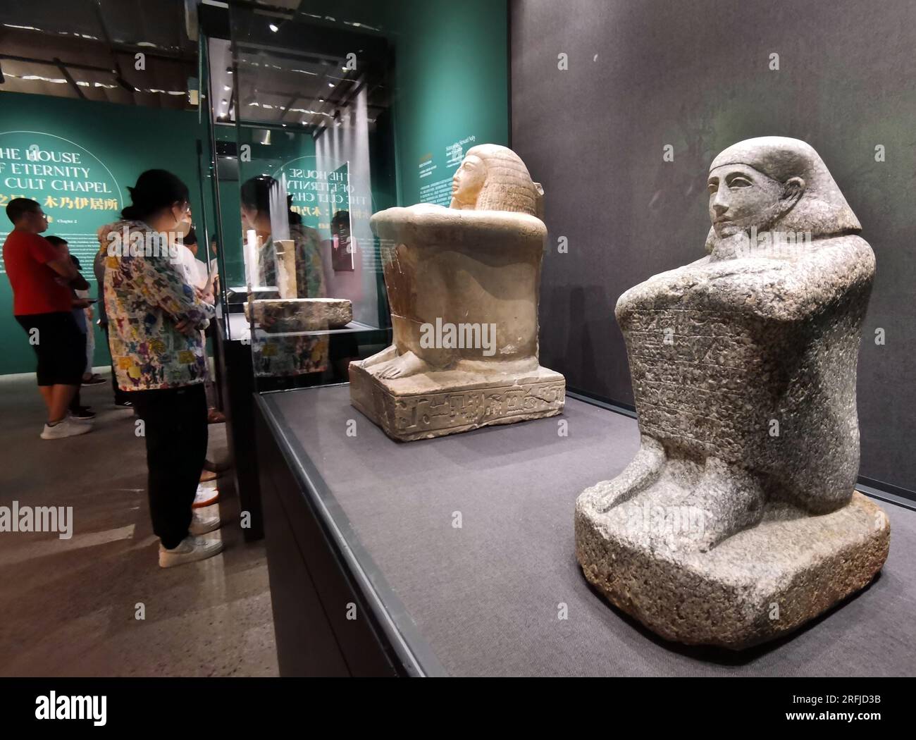People visit the exhibition featuring mummies and rare relics of ...