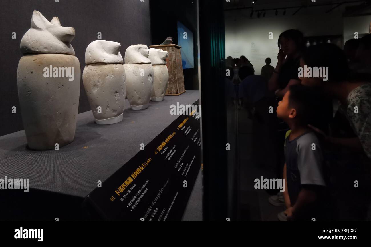 People visit the exhibition featuring mummies and rare relics of ...