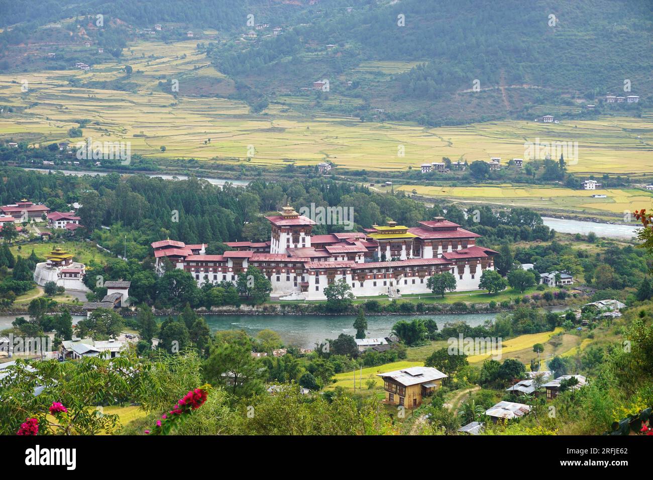 View of Punakha Dzong surrounded by two rivers with a mosaic of ...
