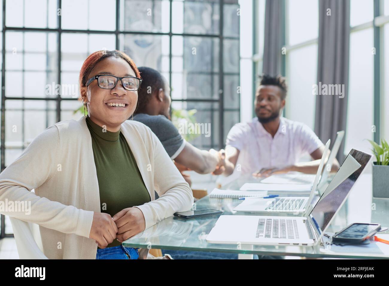 Office with employees working on computers Stock Photo - Alamy