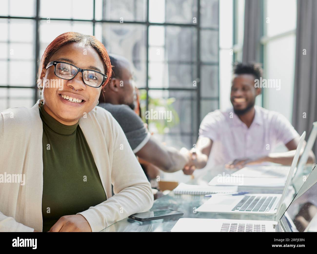 Office with employees working on computers Stock Photo - Alamy