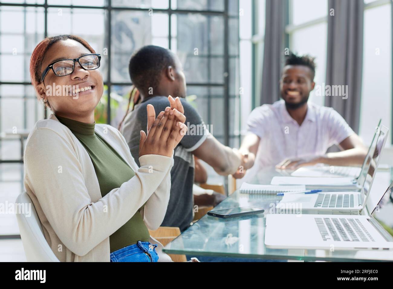 Office with employees working on computers Stock Photo - Alamy
