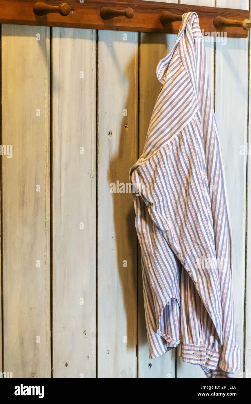 Flanel shirt hangig from wooden coat rack of the Amuri Museum of ...